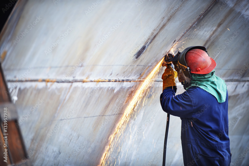 Side view of worker welding ship at industry Stock Photo | Adobe Stock