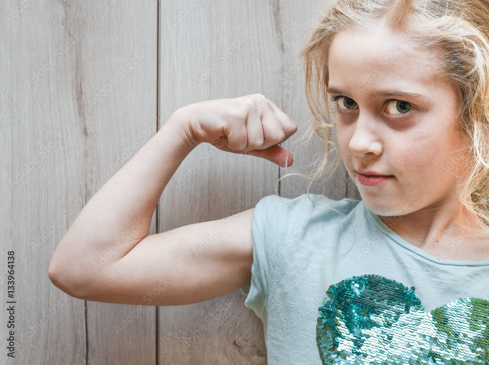 Strong blonde girl Stock Photo | Adobe Stock