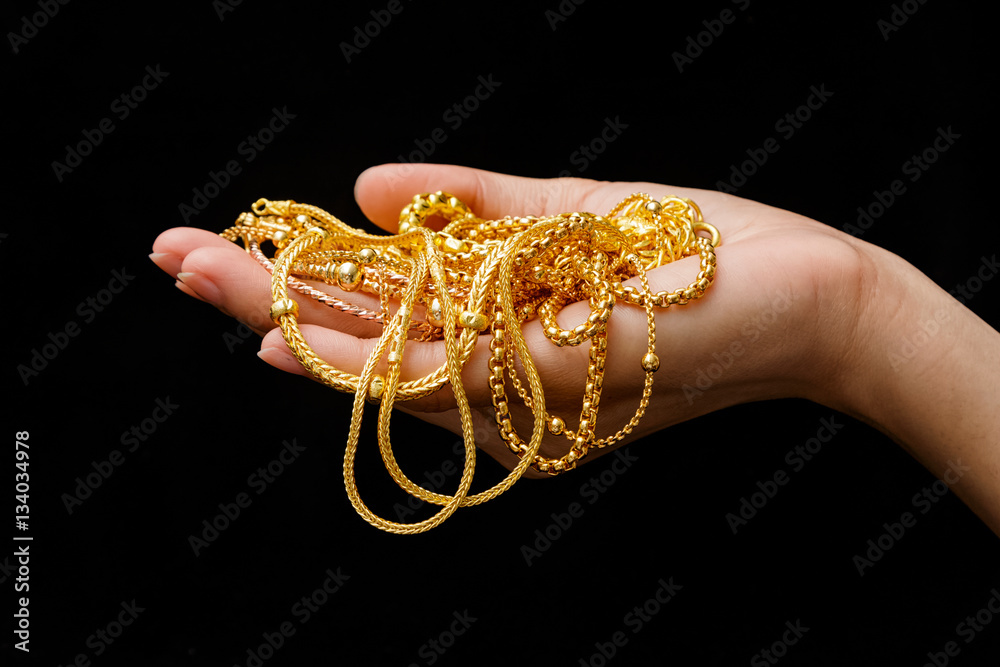 Hand Holding Expensive Gold Jewelry necklace and bracelet Stock Photo ...