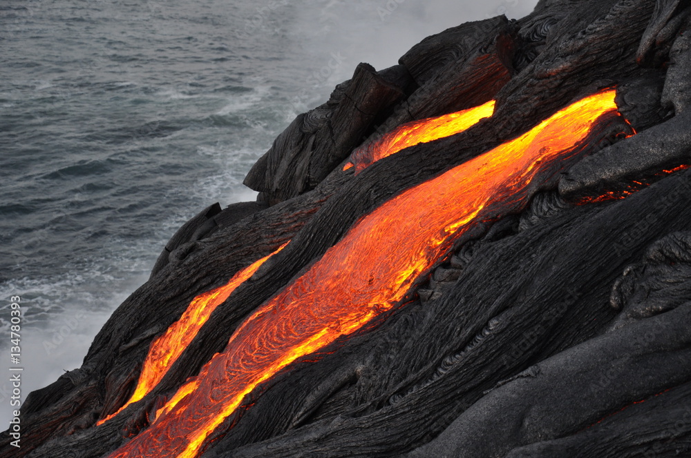 Foto de Stock lava ocean entry in the morning | Adobe Stock