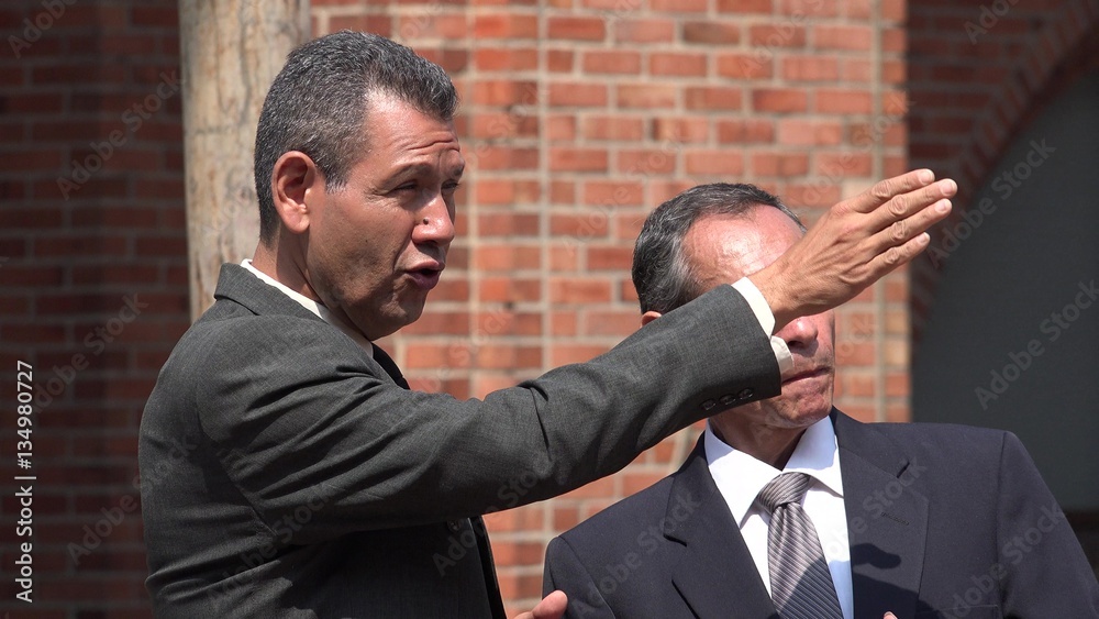 Business Man Giving Directions Stock Photo | Adobe Stock