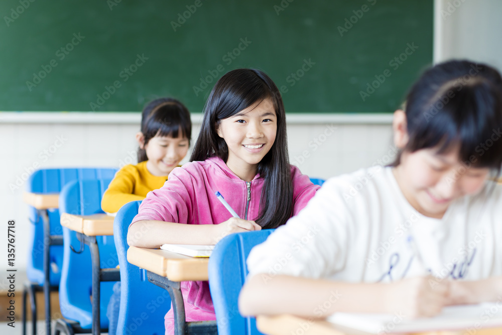 happy teenager girl learning in the classroom Stock Photo | Adobe Stock