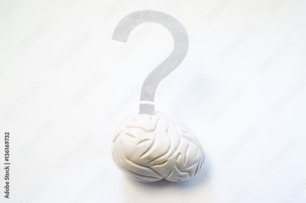 Question mark hangs over 3D model of brain. Concept photo to refer difficult issues, problems ...