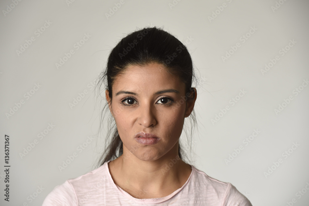 beautiful arrogant and moody latina woman showing negative feeling and ...