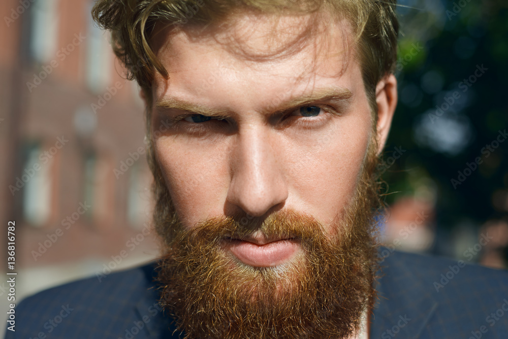Serious beard man. Person with aggressive look in the street with red ...
