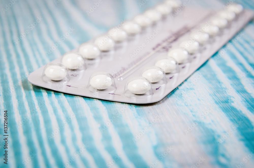 Contraceptive Pill with English Instructions.. Wooden vintage blue ...