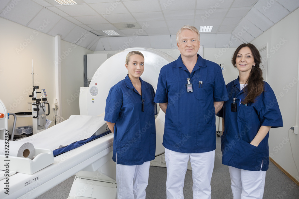 Confident Medical Team Smiling By MRI Machine Stock Photo | Adobe Stock
