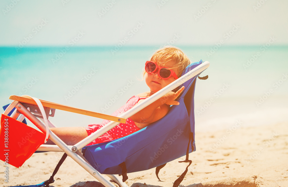 cute little girl relax on tropical beach Stock Photo | Adobe Stock