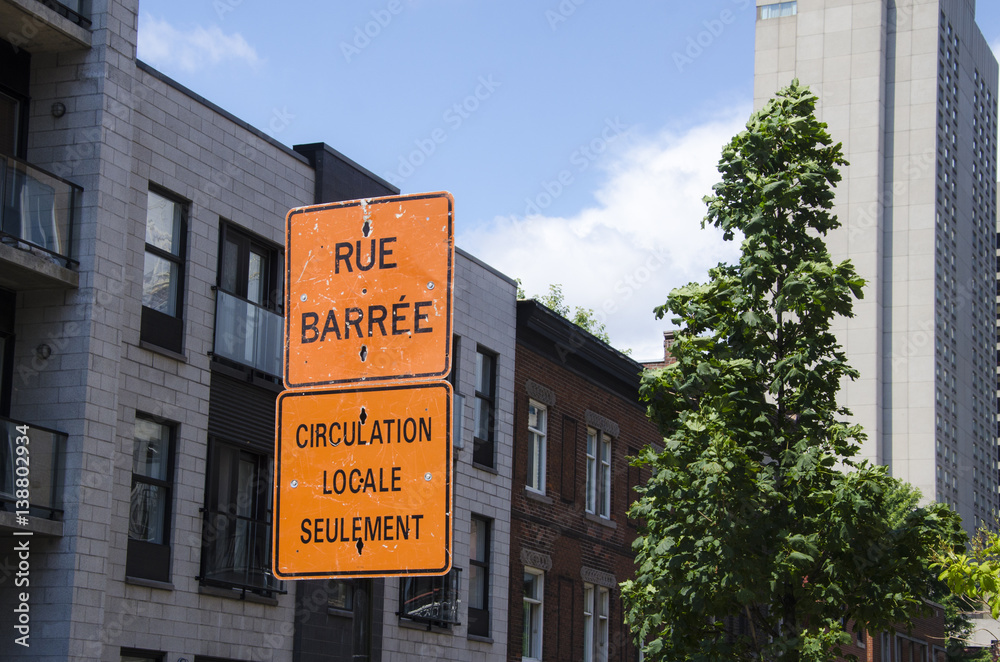 Warning traffic sign for construction works in the street in Montreal ...