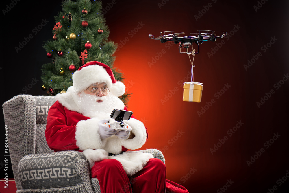 Santa Claus using drone Stock Photo | Adobe Stock
