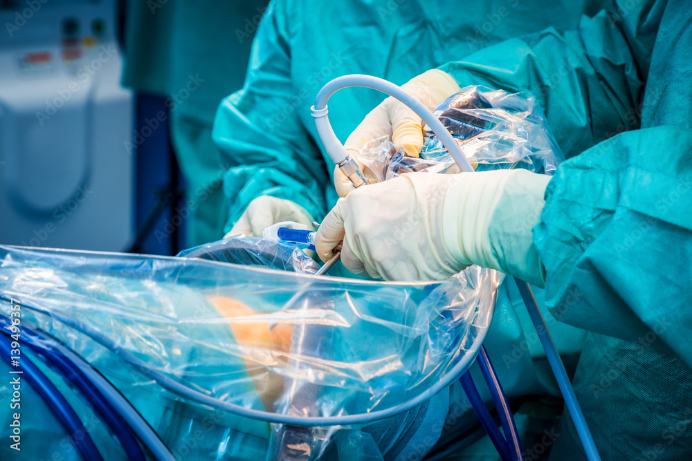 Orthopedic surgeons performing knee arthroscopic surgery after injury ...