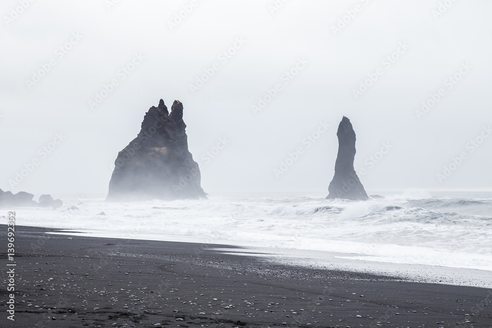 Beautiful volcanic rock formations on black sand beach in Dyrholaey ...