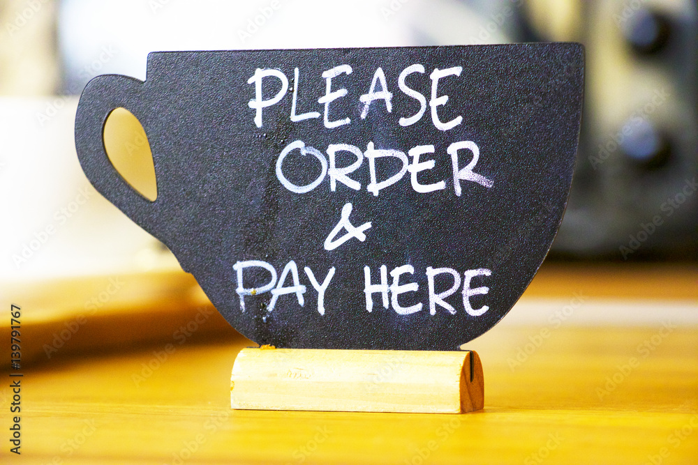 sign of please order and pay here Stock Photo | Adobe Stock