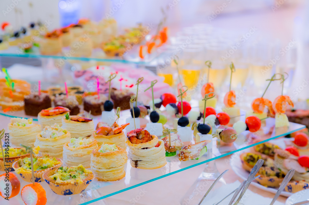 Foto de Stock Delicacies and snacks in the buffet. Champagne. Seafood ...
