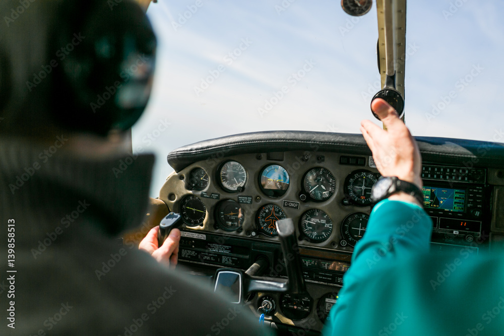 Flight instructor and student inside small Piper aircraft Stock Photo ...