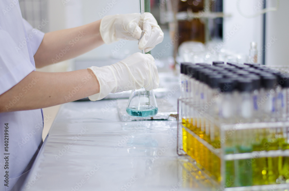 Scientist hand titration at laboratory, titrate chemical, titration ...