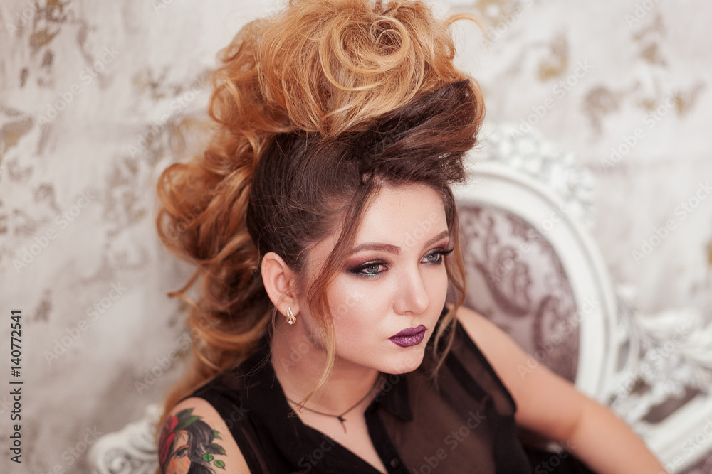 Fashion shiny makeup. Beauty woman with mohawk hairstyle. Blonde sexy ...