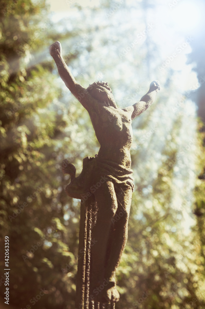 Jesus Christ crucified (an ancient sculpture) Stock Photo | Adobe Stock