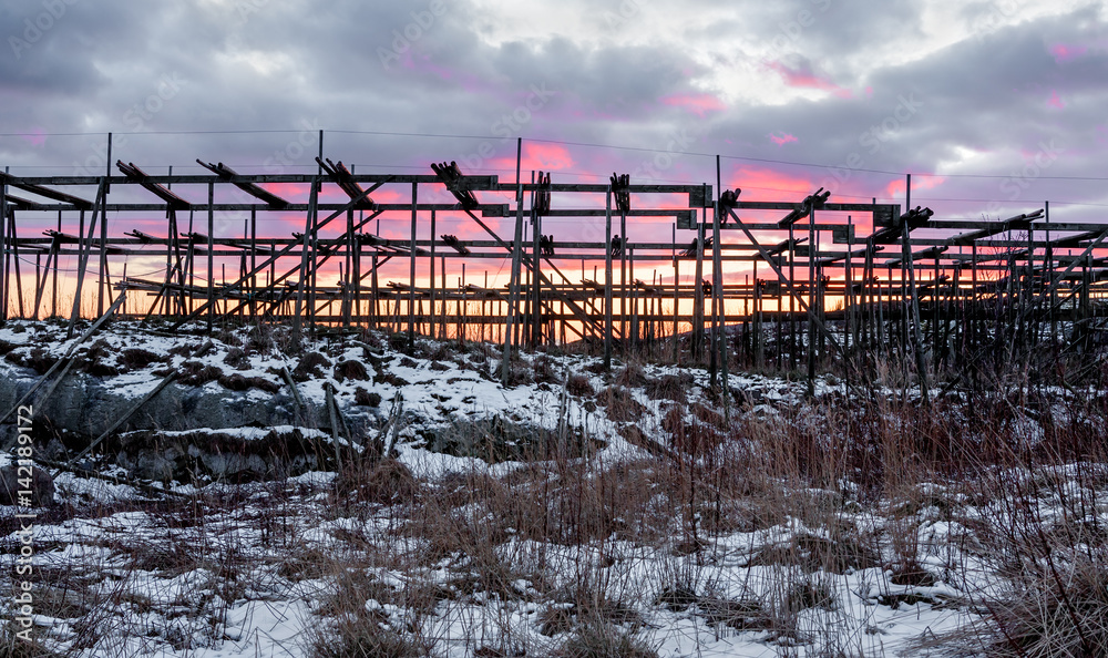 Стоковое фото «Dryer for fish that are filled when the cod spawn at sunset - Reine, Lofoten ...