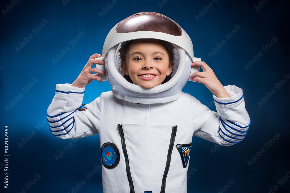 Little girl in space suit Stock Photo | Adobe Stock