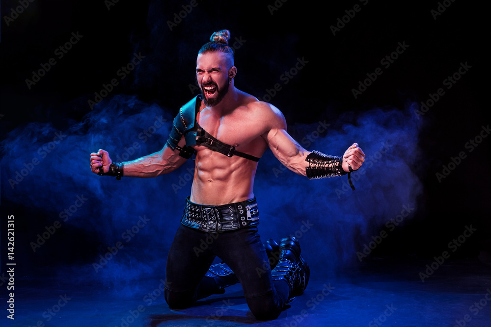 Handsome young sexy man with beautiful muscular chest in interesting ...