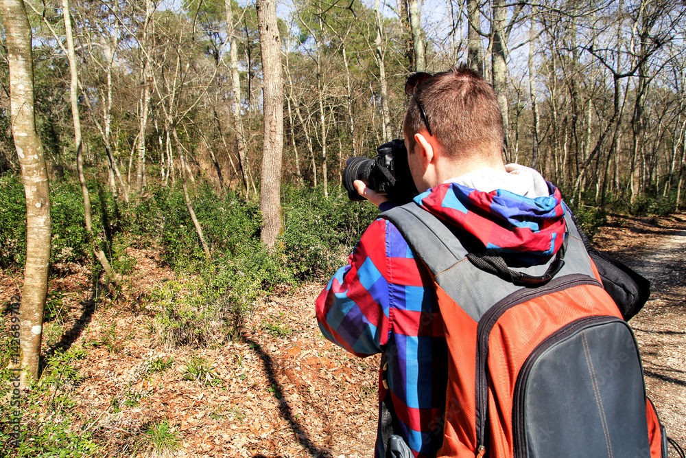 Photographer in the forest. Guys in nature photography forest ...