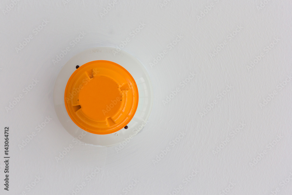 Smoke detector fire alarm on celling with copy space and text. Also a ...