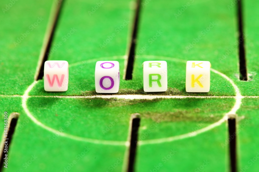 The plastic text box arrange to the word work on green color background ...