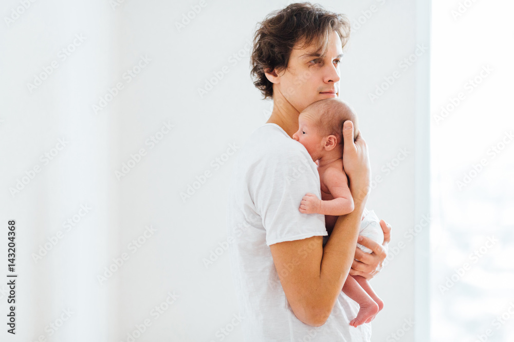 Happy father hugging and holding newborn baby on white background ...