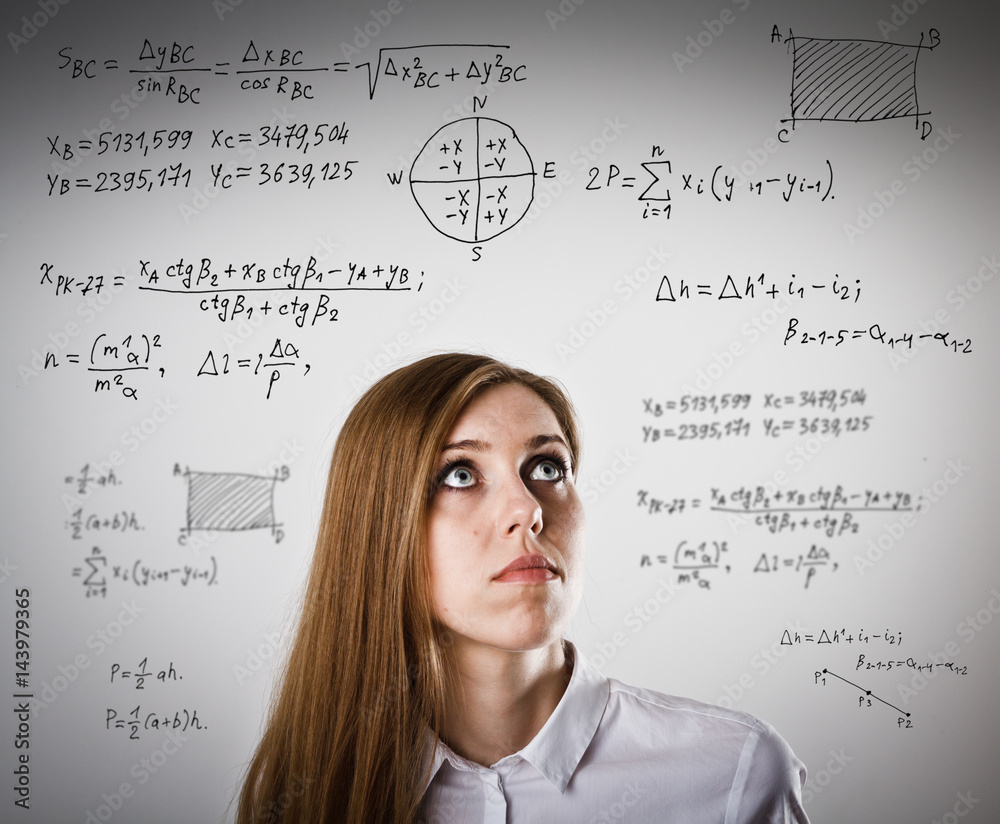 Woman in white is solving equation Stock Photo | Adobe Stock