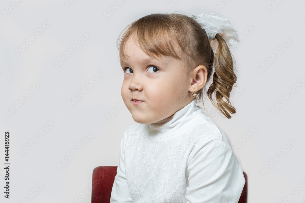 Little girl turned her head Stock Photo | Adobe Stock