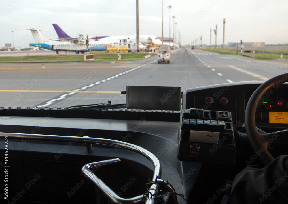 The view through the windshield of the bus at the airport. Transporting ...