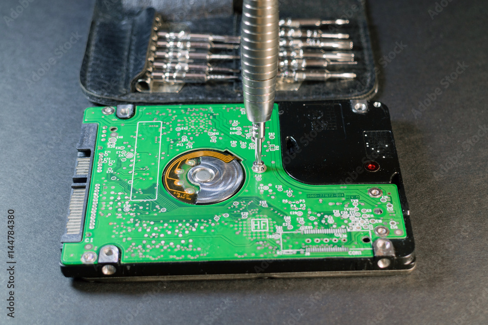 Disassembly of laptop hard disk drive Stock Photo | Adobe Stock