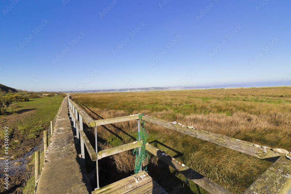 Scenic coastal view across the salt marshes & sand dunes at Red Wharf ...