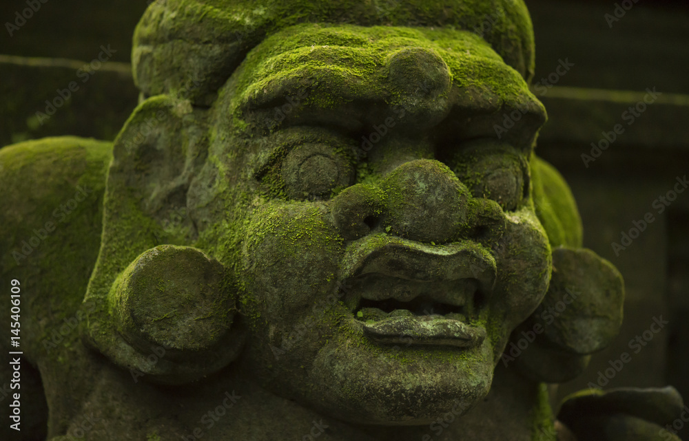 Statues and carvings depicting demons, gods and Balinese mythological ...