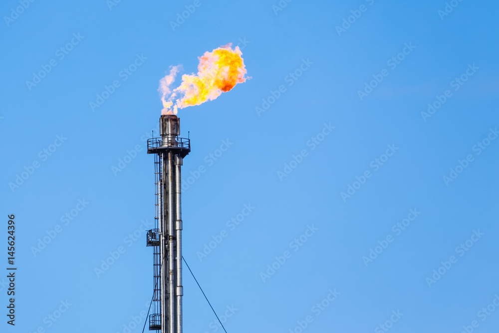 Refinery flare - Burning of dangerous gases in the oil field. Stock ...
