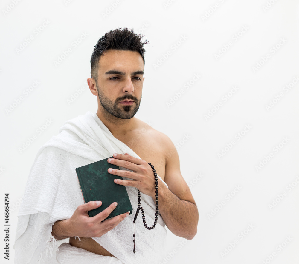 Muslim man posing as ready for Hajj visiting Kaaba in Mecca Stock Photo ...