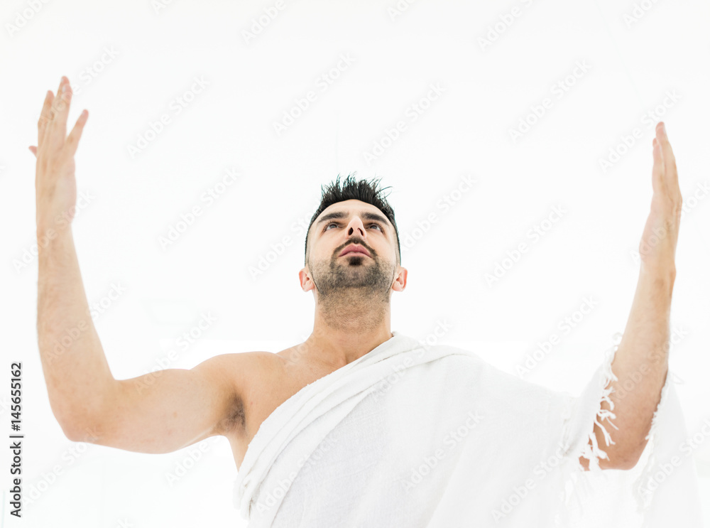 Muslim man posing as ready for Hajj visiting Kaaba in Mecca Stock Photo ...