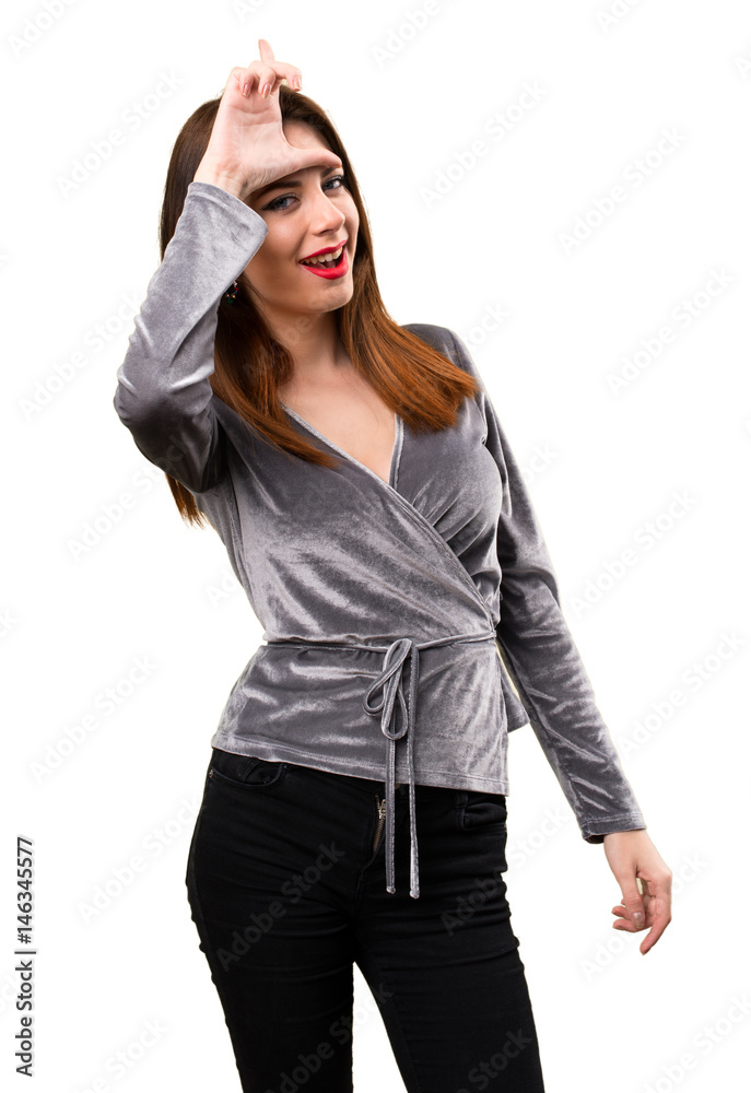 Beautiful young girl making loser sign Stock Photo | Adobe Stock
