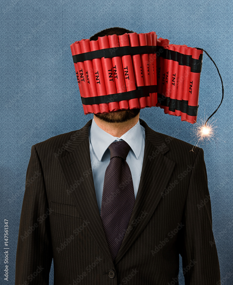 Businessman wrapped in dynamite Stock Photo | Adobe Stock