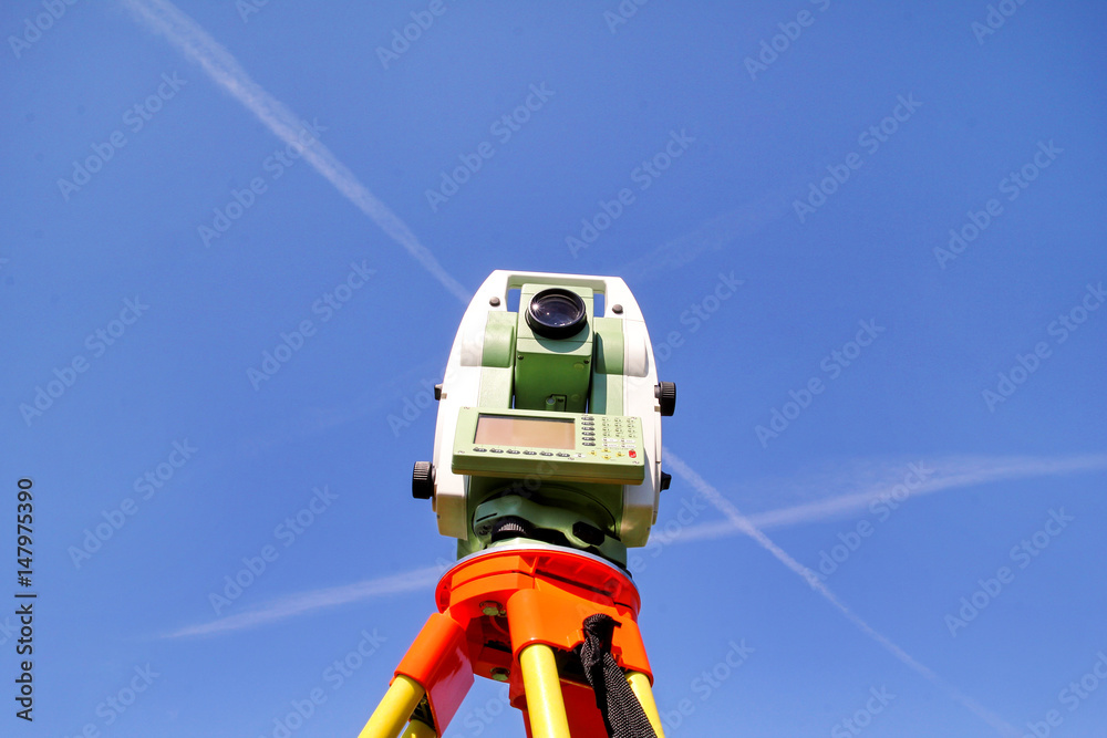 Total station with blue sky in the background. Survey Instrument ...