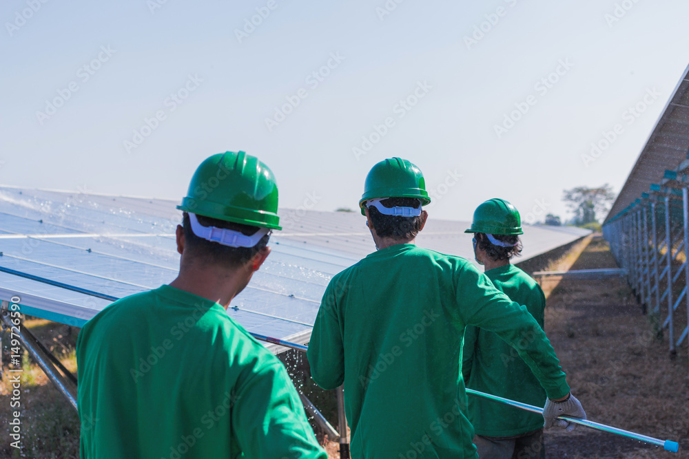 labor working on cleaning solar panel at solar power plant Stock Photo ...