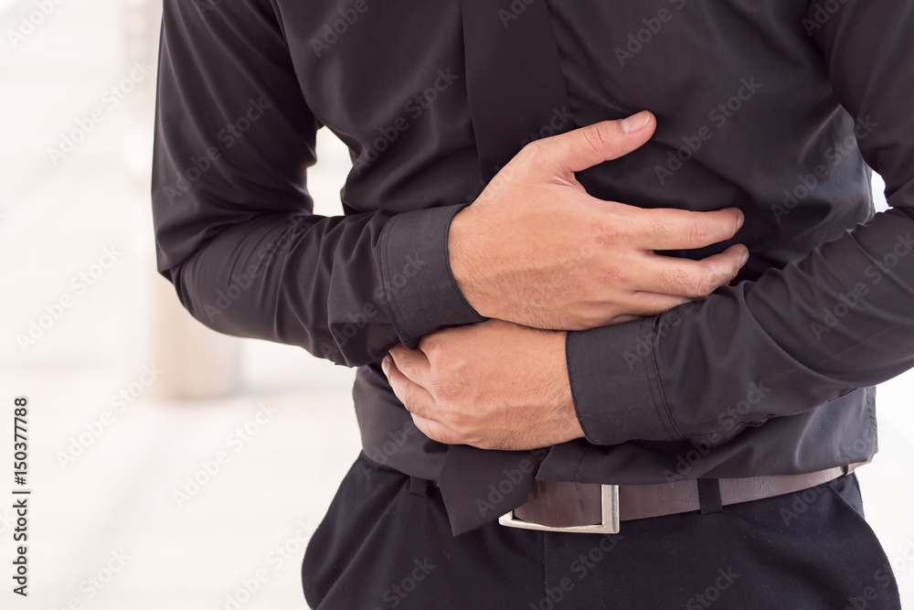 man suffering from stomach ache, diarrhea, constipation, acid reflux ...