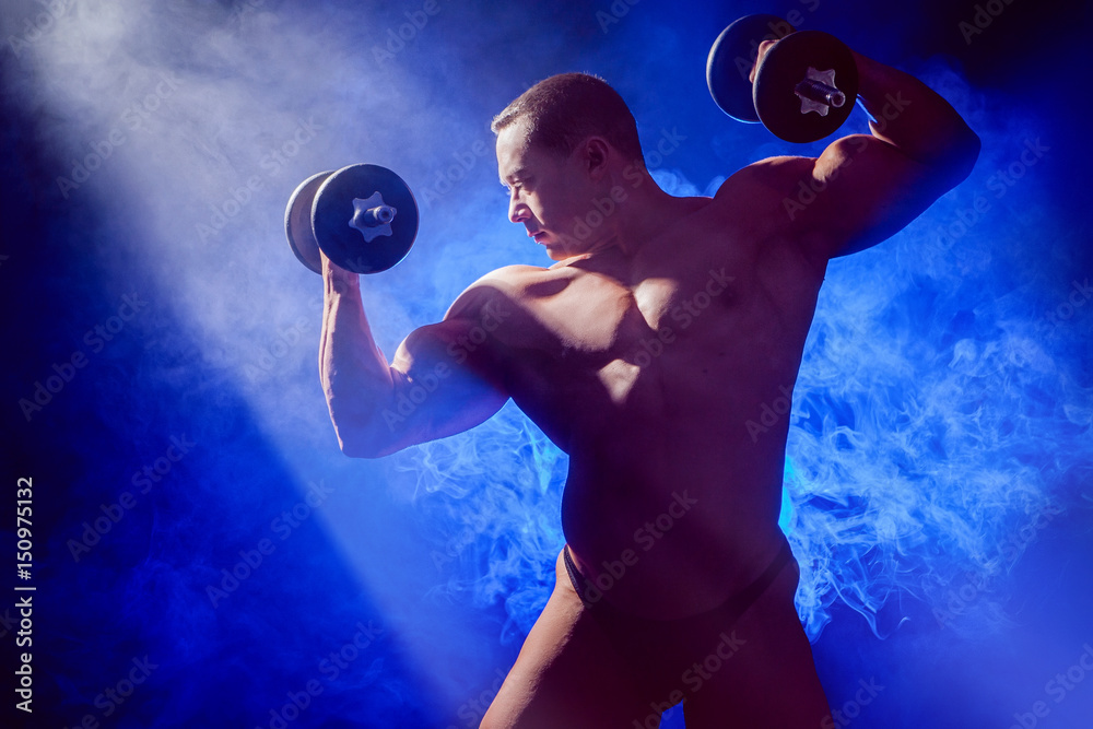 Closeup of a handsome power athletic man bodybuilder resting while ...