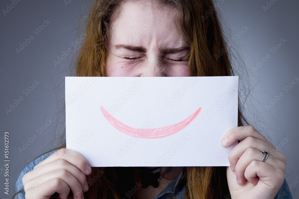 Woman showing a blank paper with a smile and happy emotion as a symbol ...