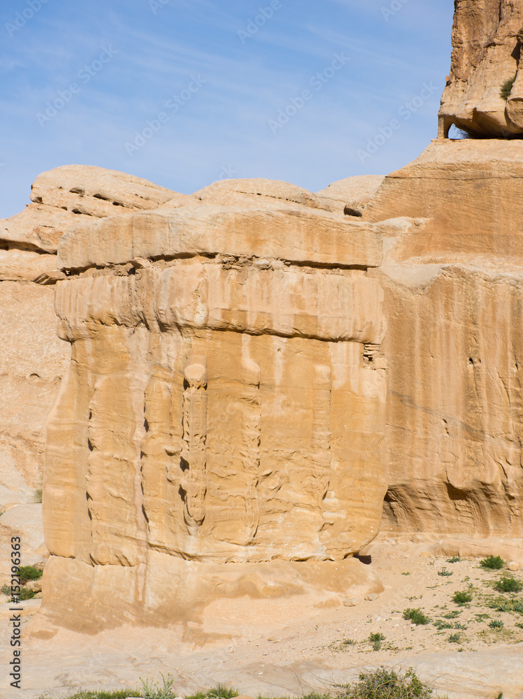 Ancient carved sandstone Djinn Blocks at the entrance of Petra, Jordan ...