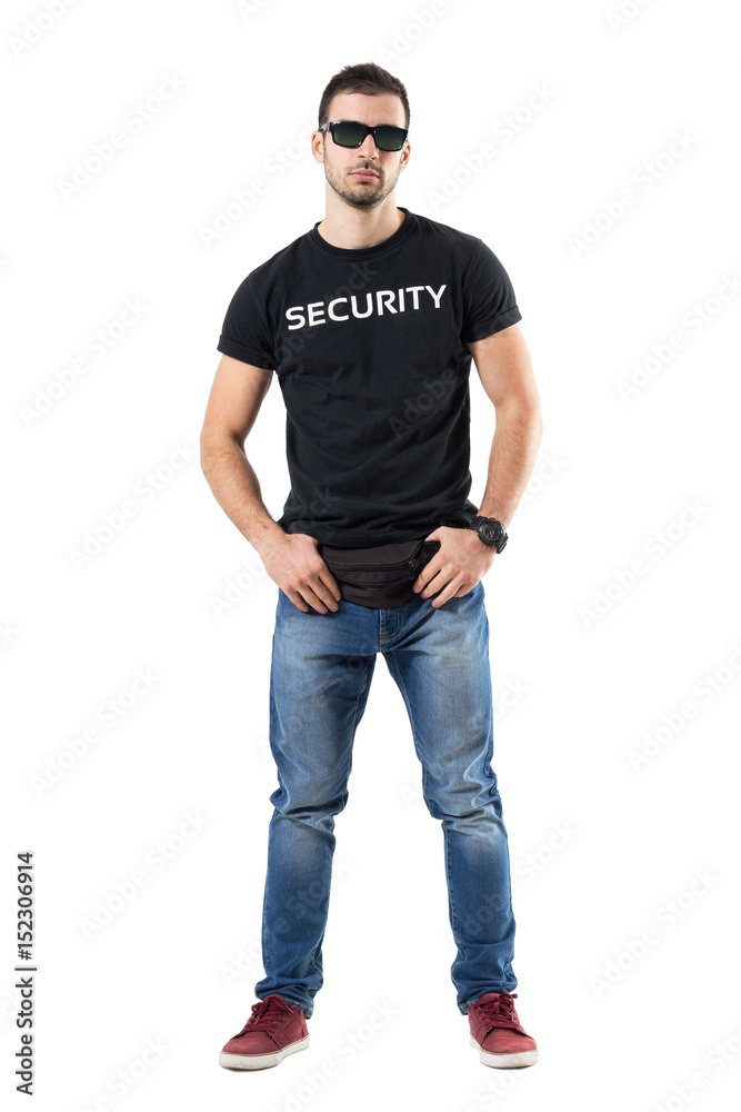 Undercover policeman holding fanny pack belt looking at camera with ...