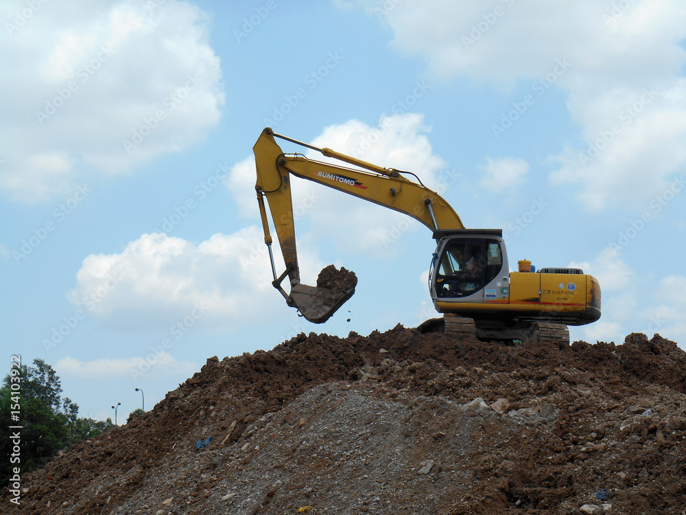 Construction workers installing and arranging precast concrete pavers ...