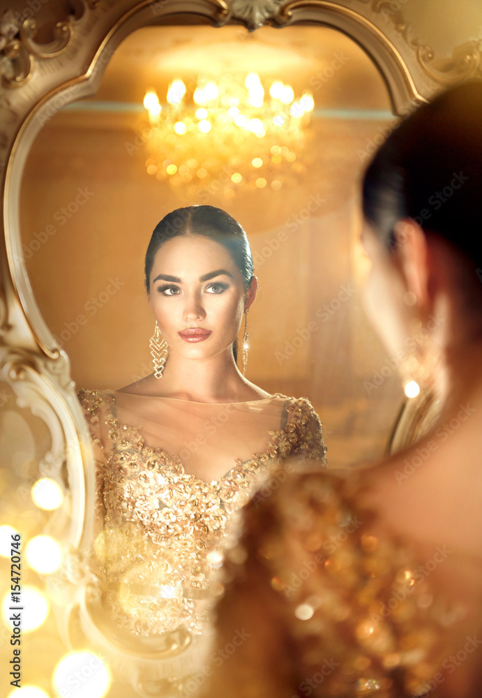 Beauty glamour lady looking in the mirror. Gorgeous woman in beautiful ...