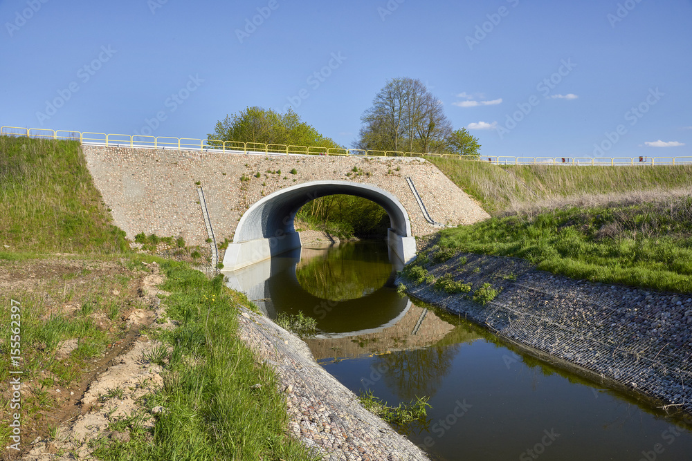 Culvert - drain under road for small river. Big pipe under freeway ...